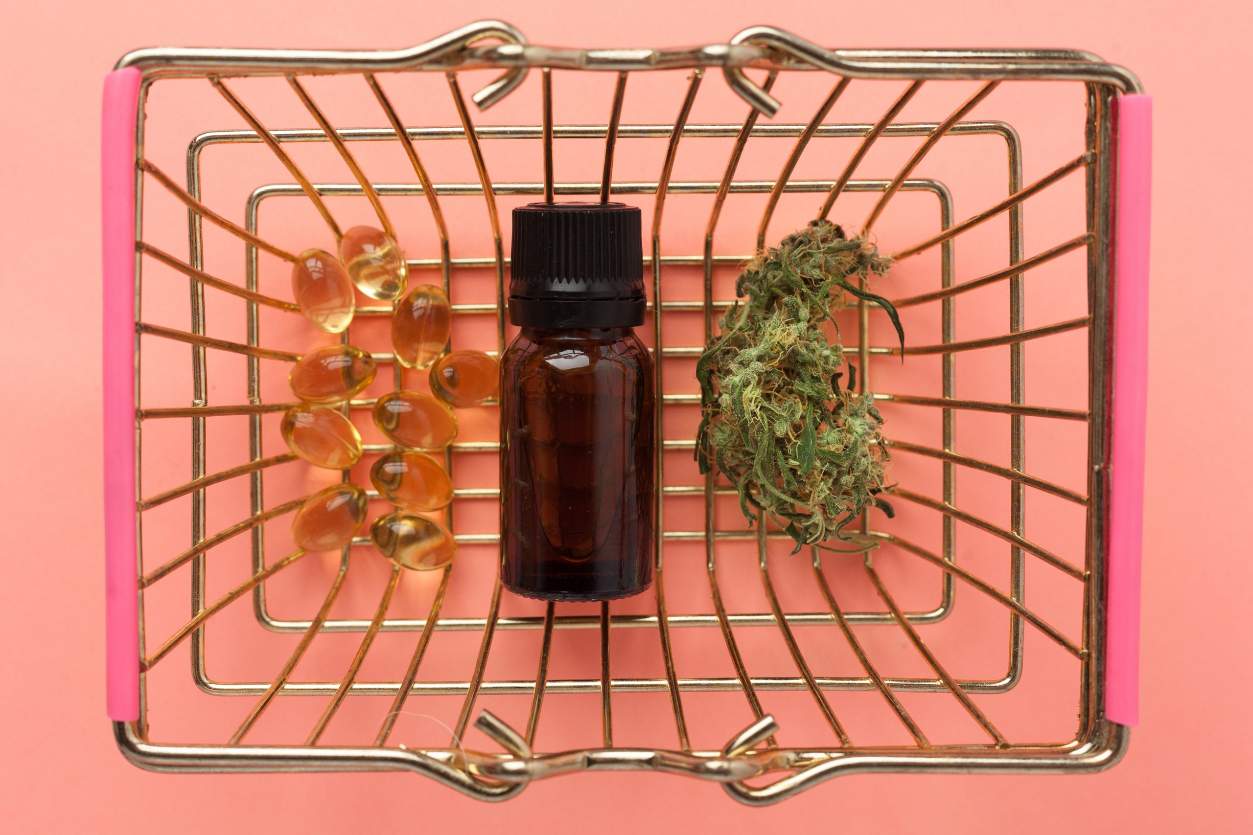 Supermarket basket with marijuana bud and medical cannabis oil cbd on ...
